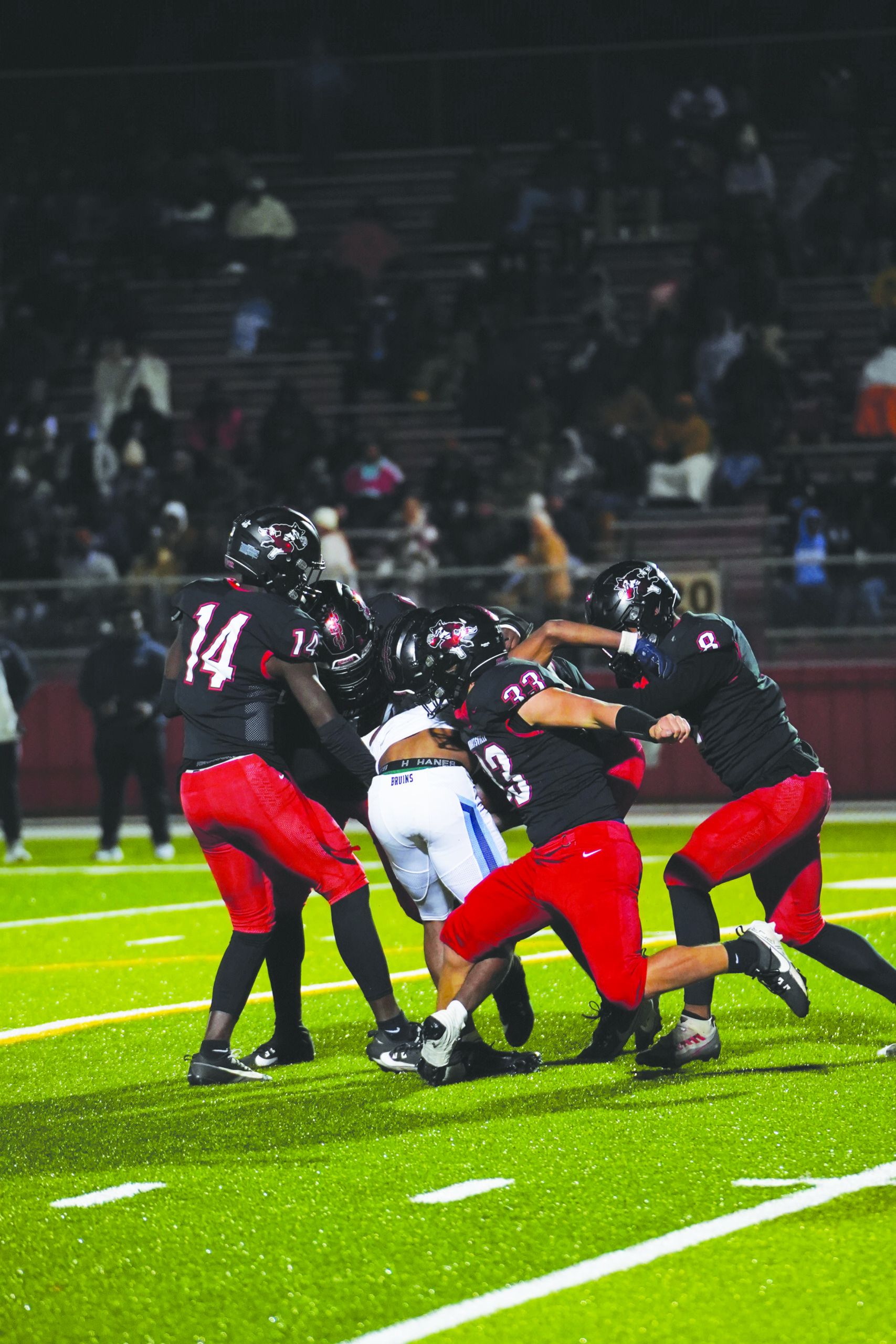 The Red Fox defense stopping a rushing attempt by the Bruins. SHOT BY B ...